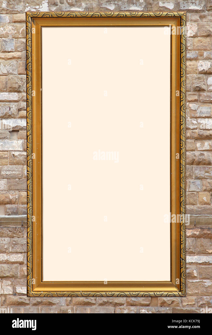 Vintage gold decorative frame on stone wall Stock Photo - Alamy