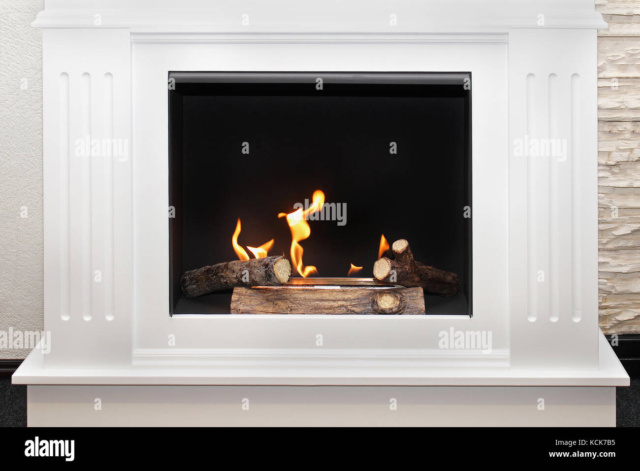 White marble fireplace in modern interior with flame burning Stock ...
