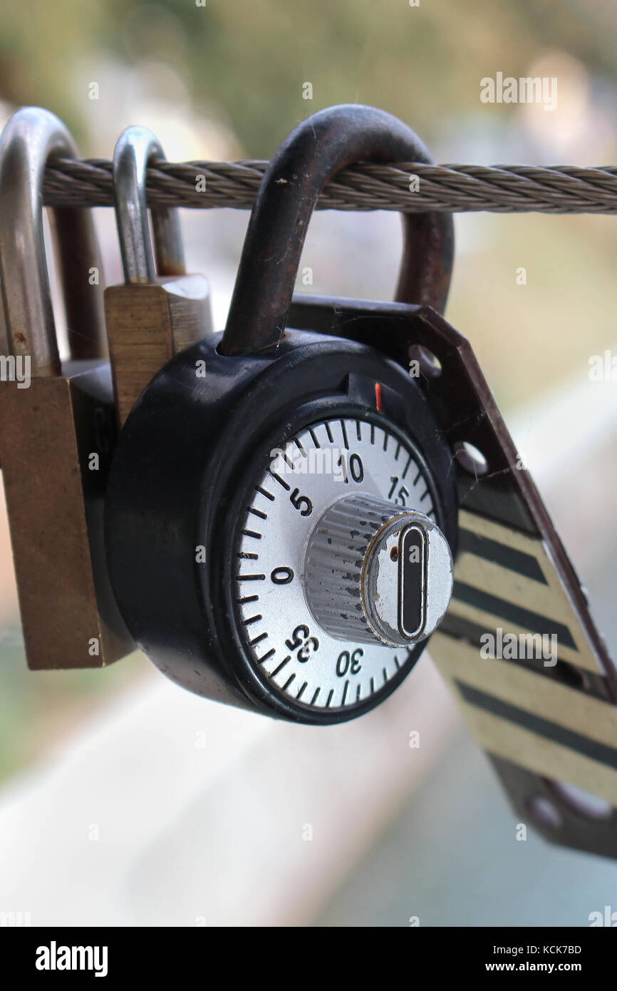 Combination secure code padlock on metal string Stock Photo - Alamy