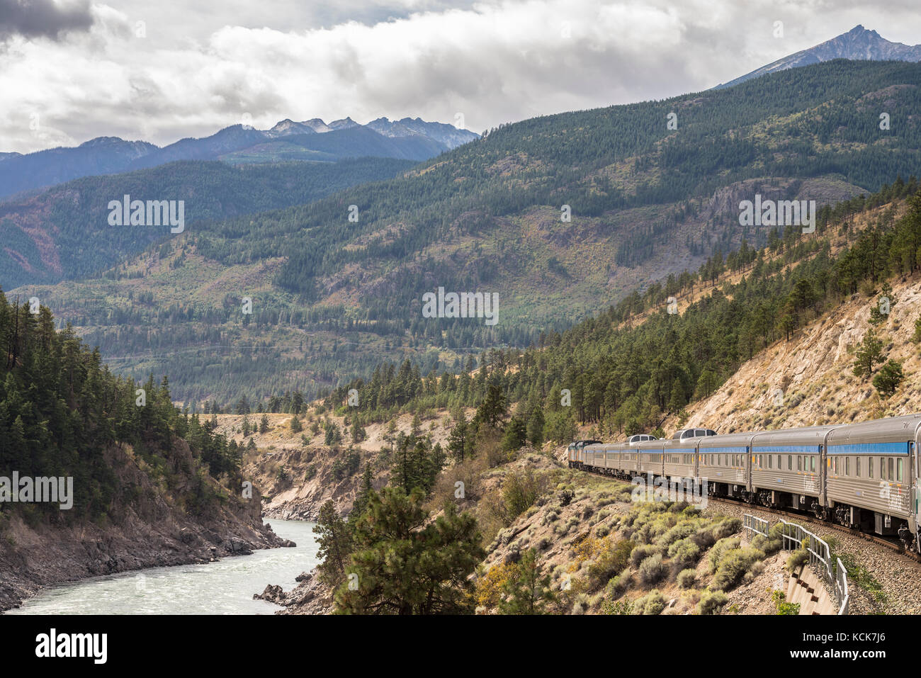 Passenger train travelling in the North Thompson River Canyon in ...