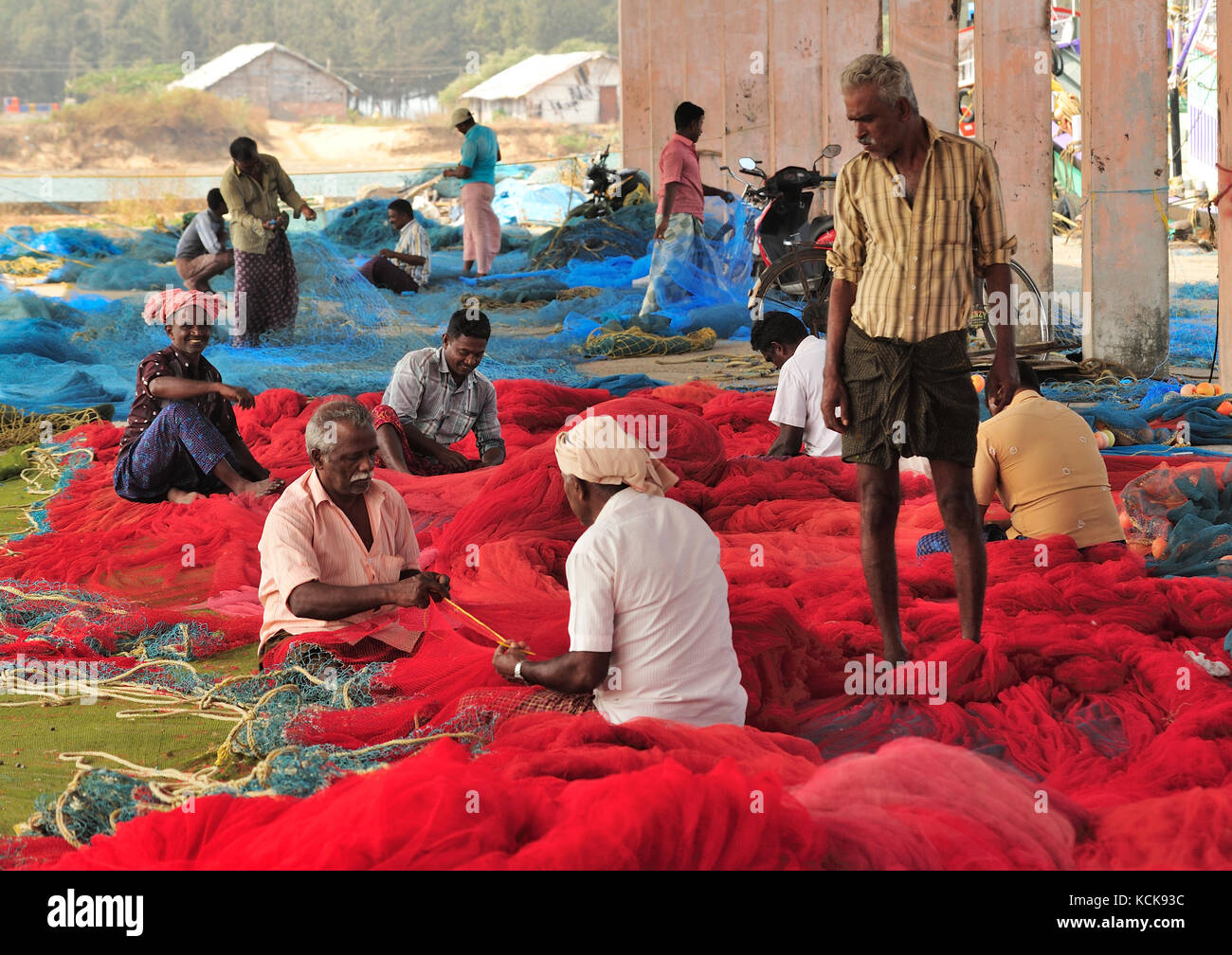 Fishermen working mending nets hi-res stock photography and images - Alamy