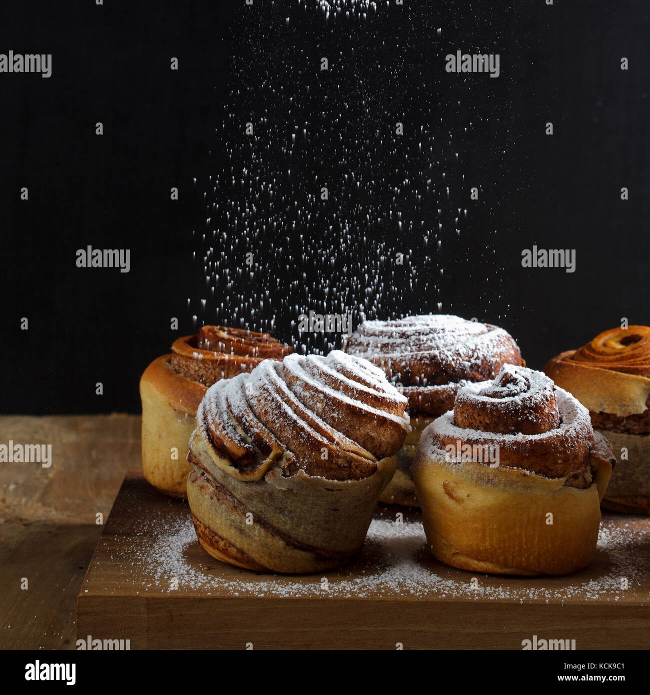 sprinkle with powdered sugar sweet rolls. morning breakfast Stock Photo ...