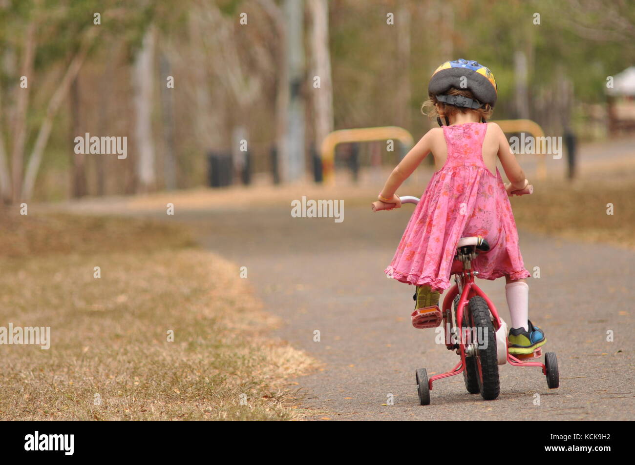A child rides on a path Stock Photo - Alamy