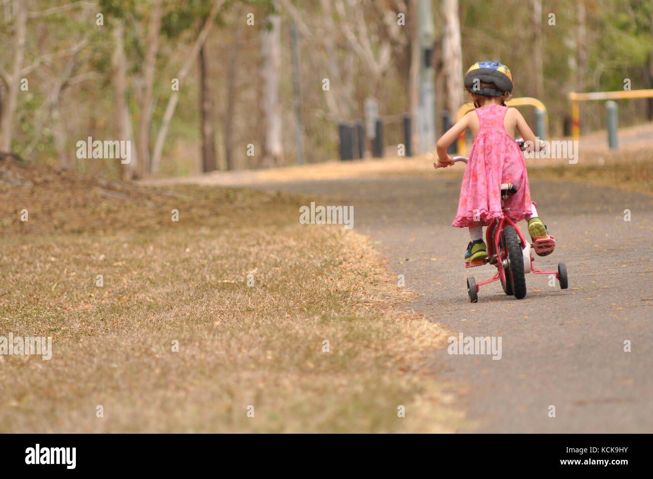 A child rides on a path Stock Photo - Alamy