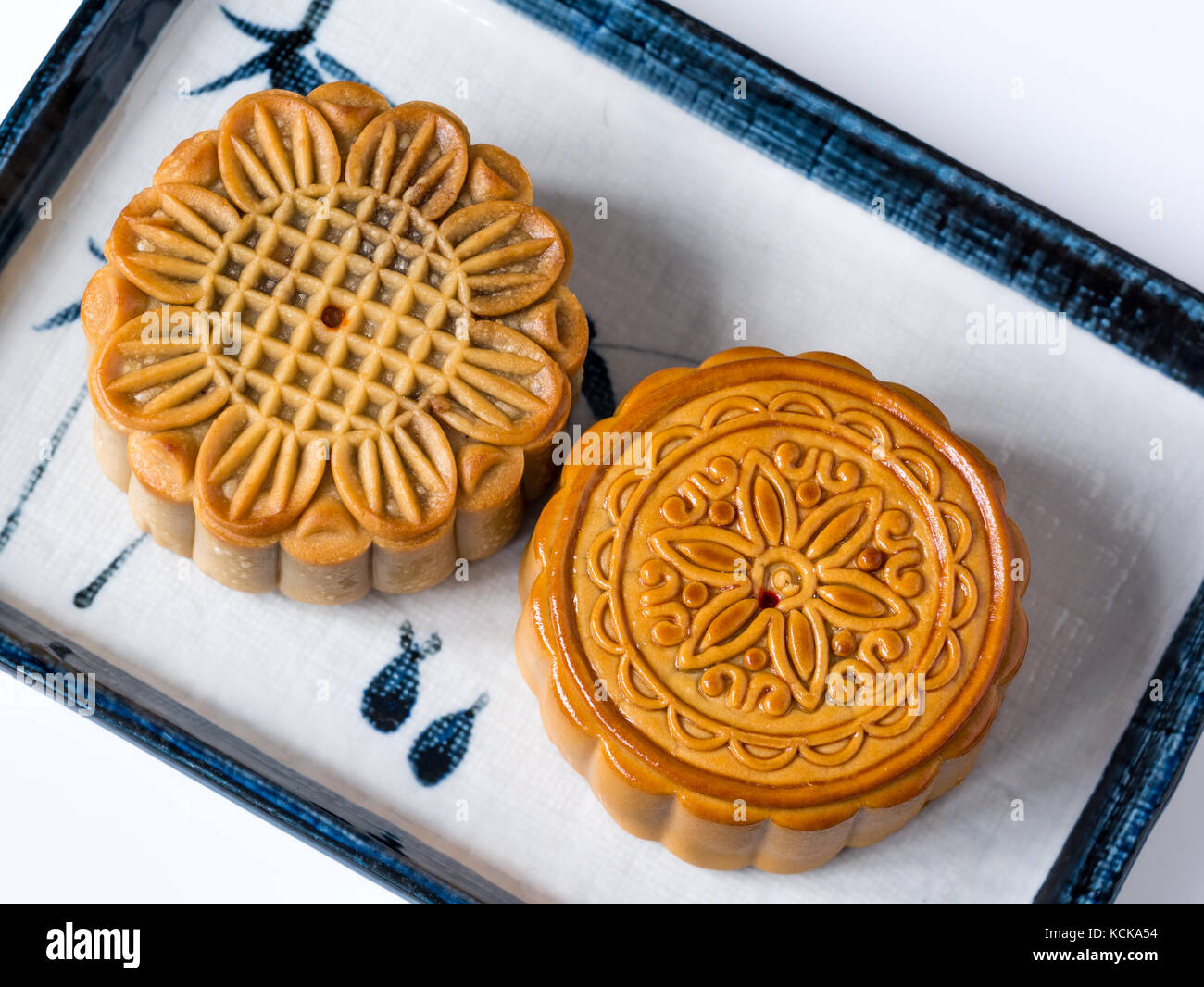 Mid autumn festival dessert, flower pattern moon cakes in white plate ...