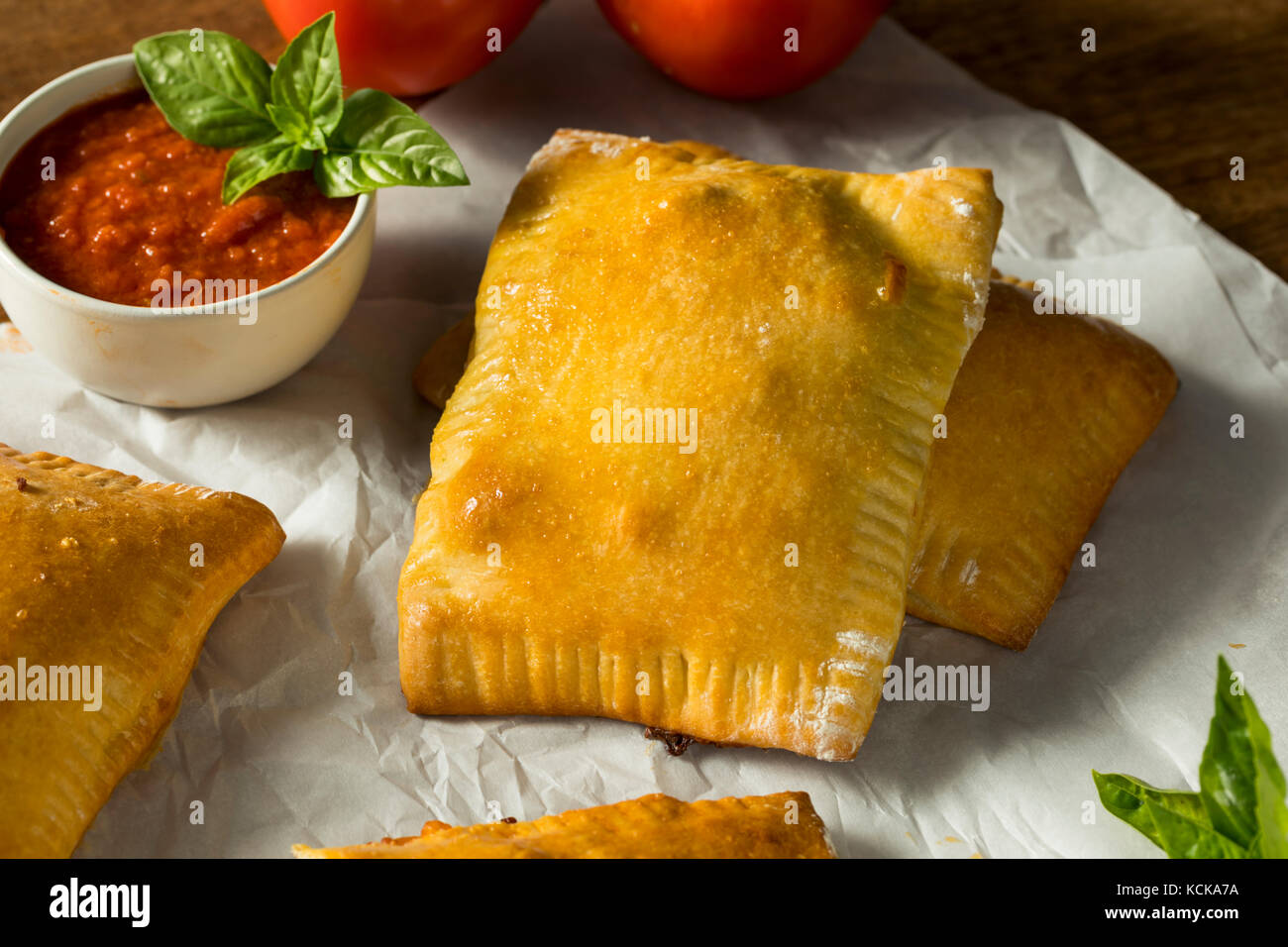 Homemade Sausage Pizza Pocket Calzone with Cheese and Marinara Stock ...