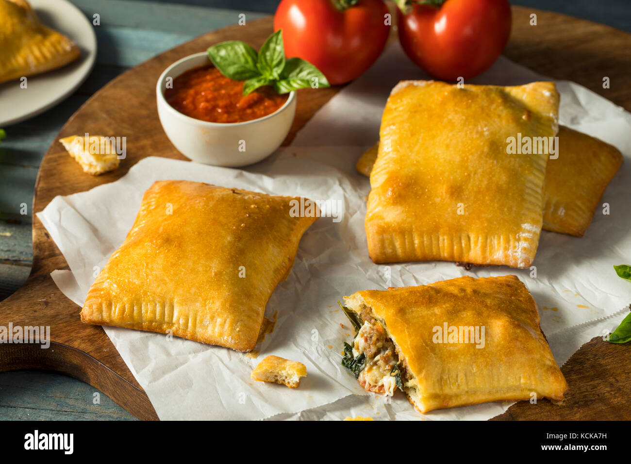 Homemade Sausage Pizza Pocket Calzone with Cheese and Marinara Stock ...