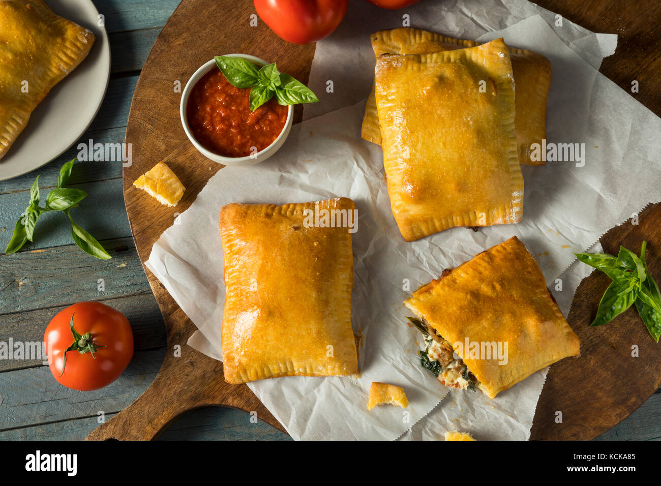 Homemade Sausage Pizza Pocket Calzone with Cheese and Marinara Stock ...