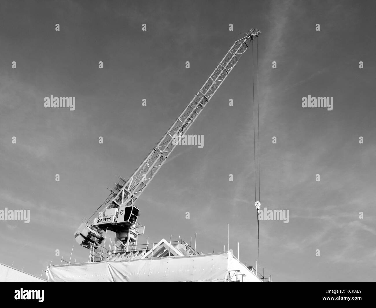 Construction site tower crane over building development Stock Photo - Alamy