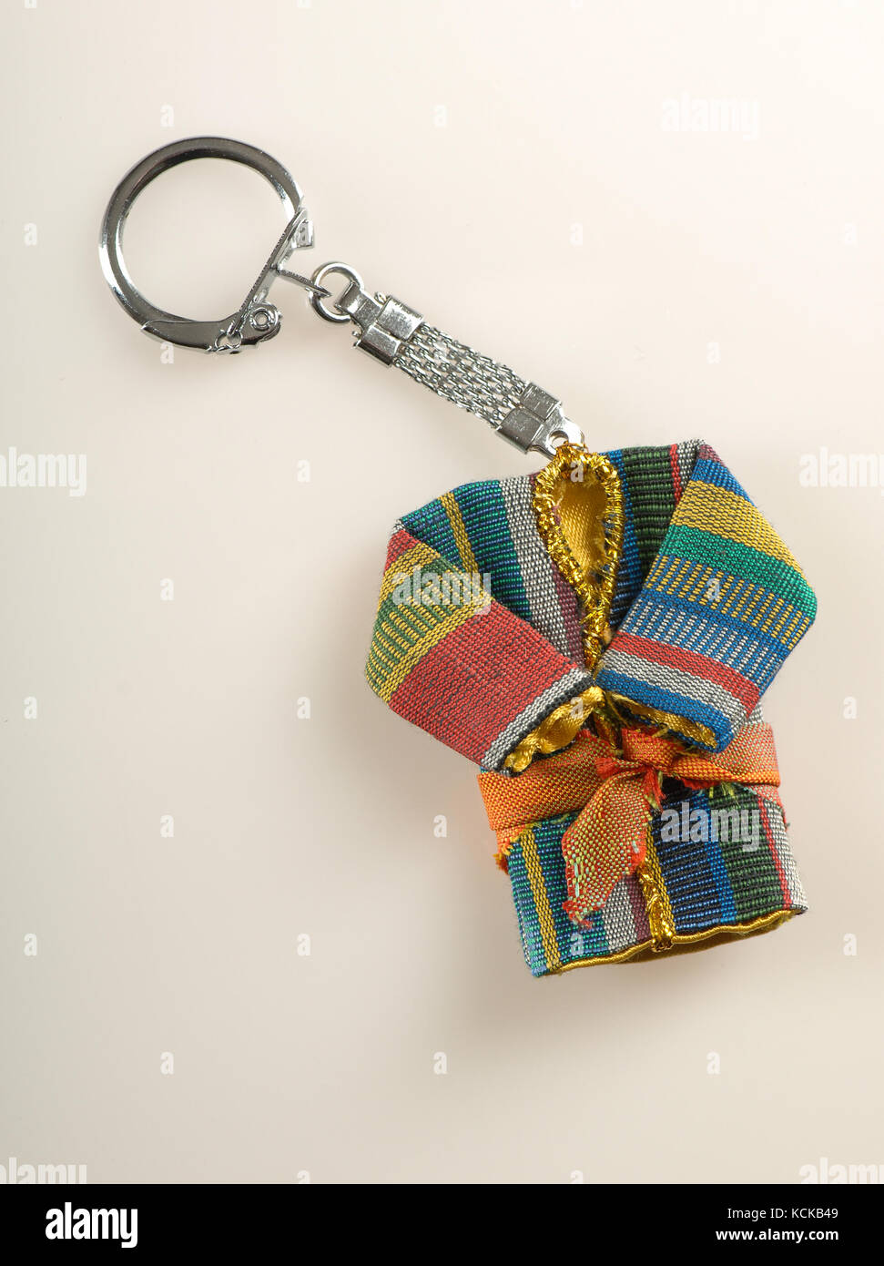 keychain in the form of national Oriental clothing on white background ...