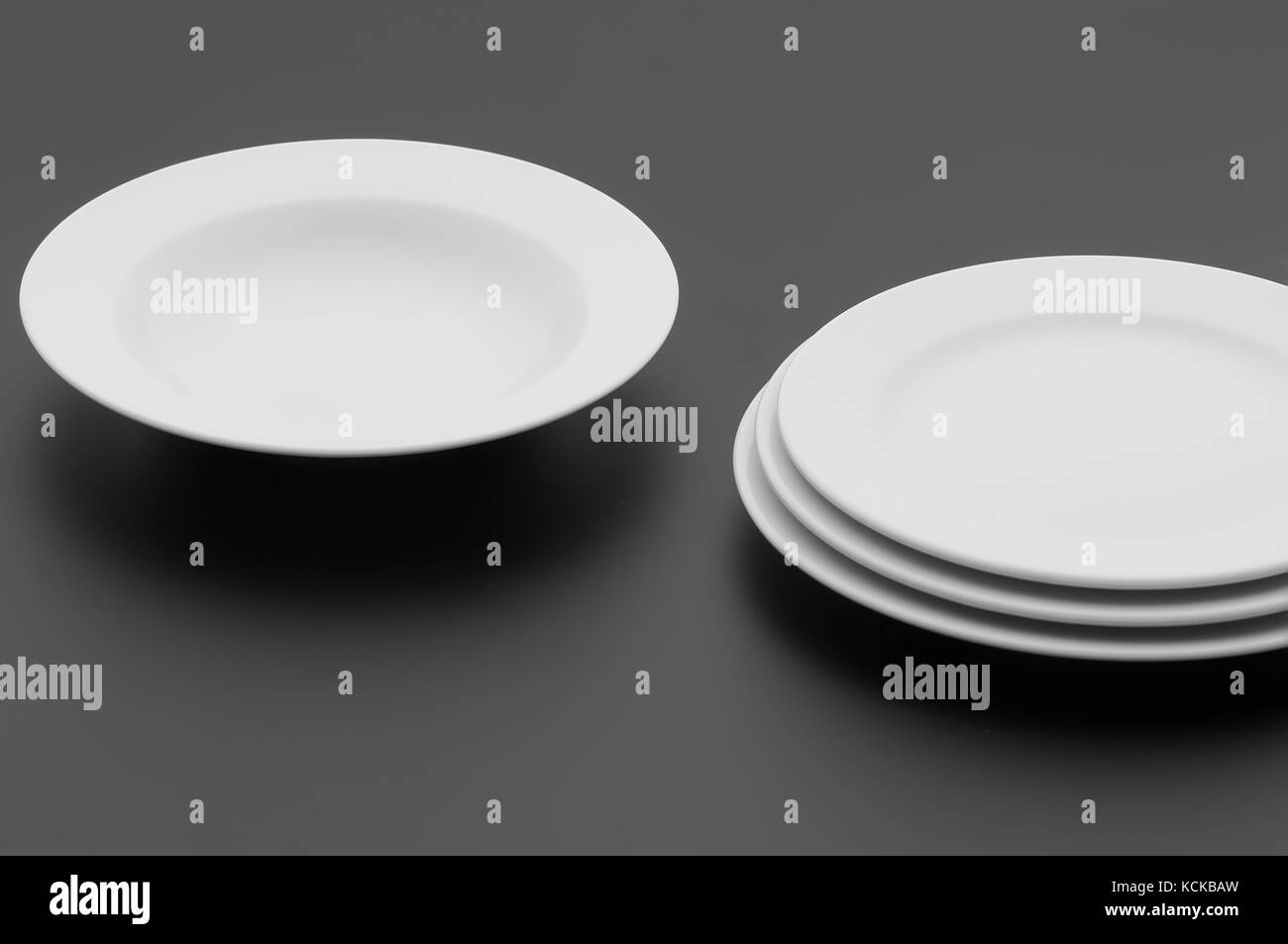 kitchen and restaurant utensils, plates, on a dark background Stock ...