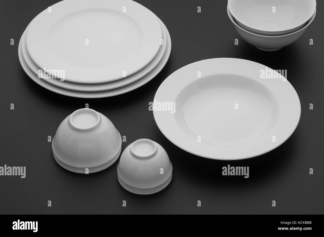 kitchen and restaurant utensils, plates, on a dark background Stock ...