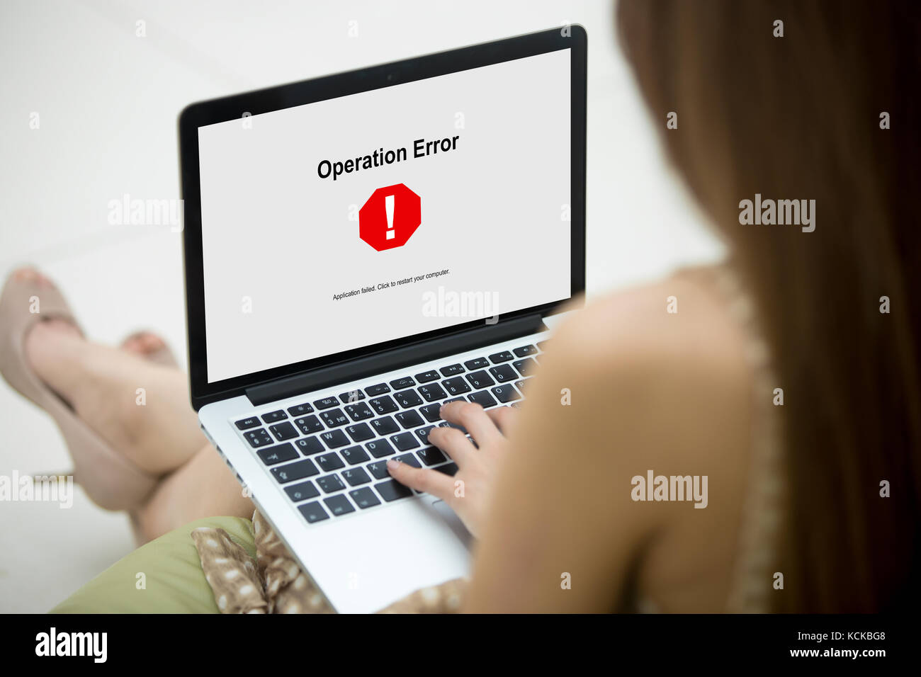Woman in nice dress looking at Operation Error on laptop screen ...