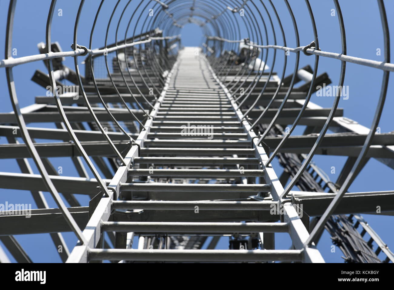 Fixed ladder for climbing on telecommunication tower Stock Photo - Alamy