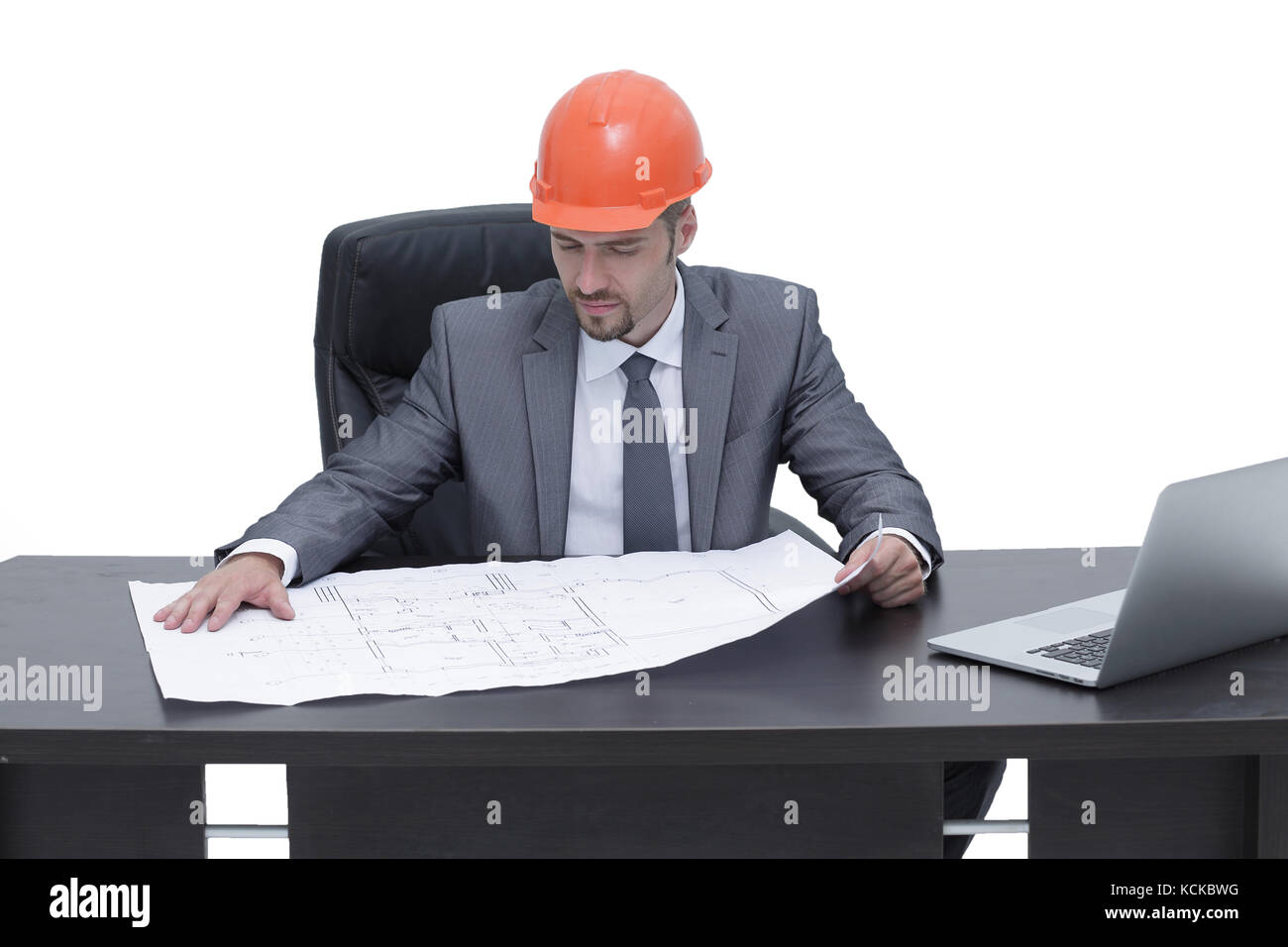 engineer is studying the draft,sitting behind a Desk Stock Photo - Alamy