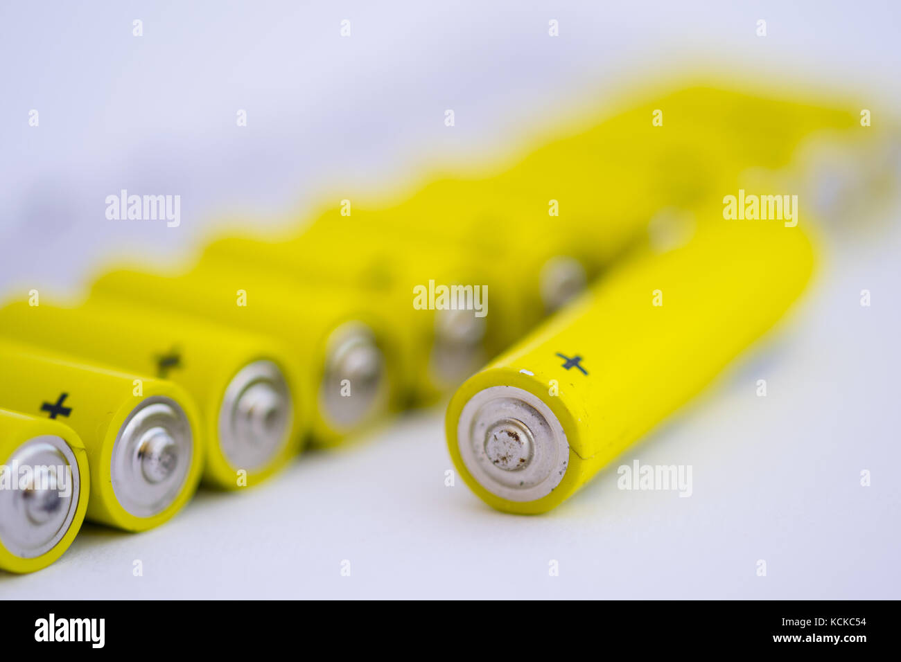 colored batteries in series with one of Its in foreground Stock Photo ...