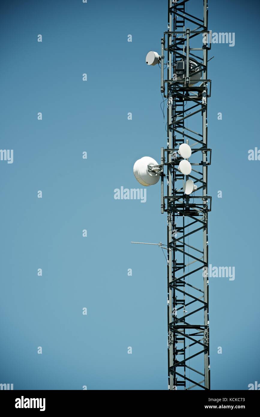 Telecommunications tower with clear blue sky Stock Photo - Alamy