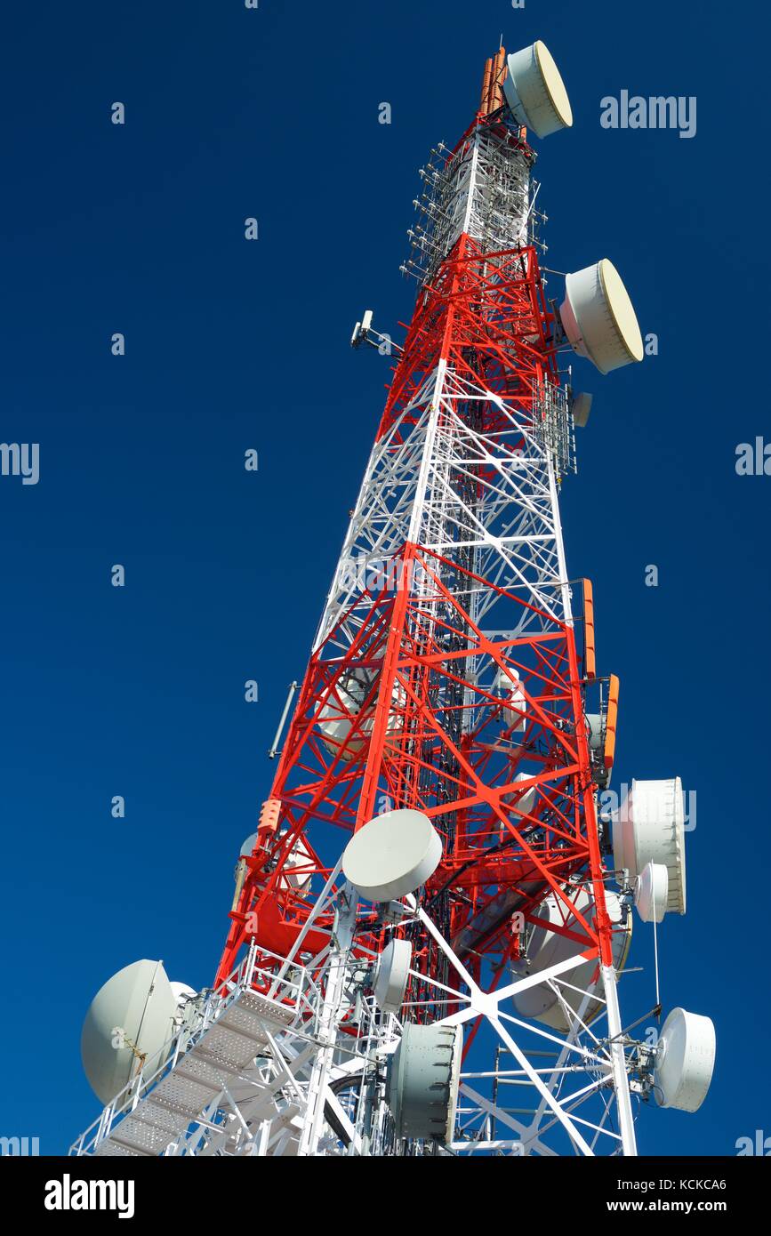 Telecommunications tower with clear blue sky Stock Photo - Alamy