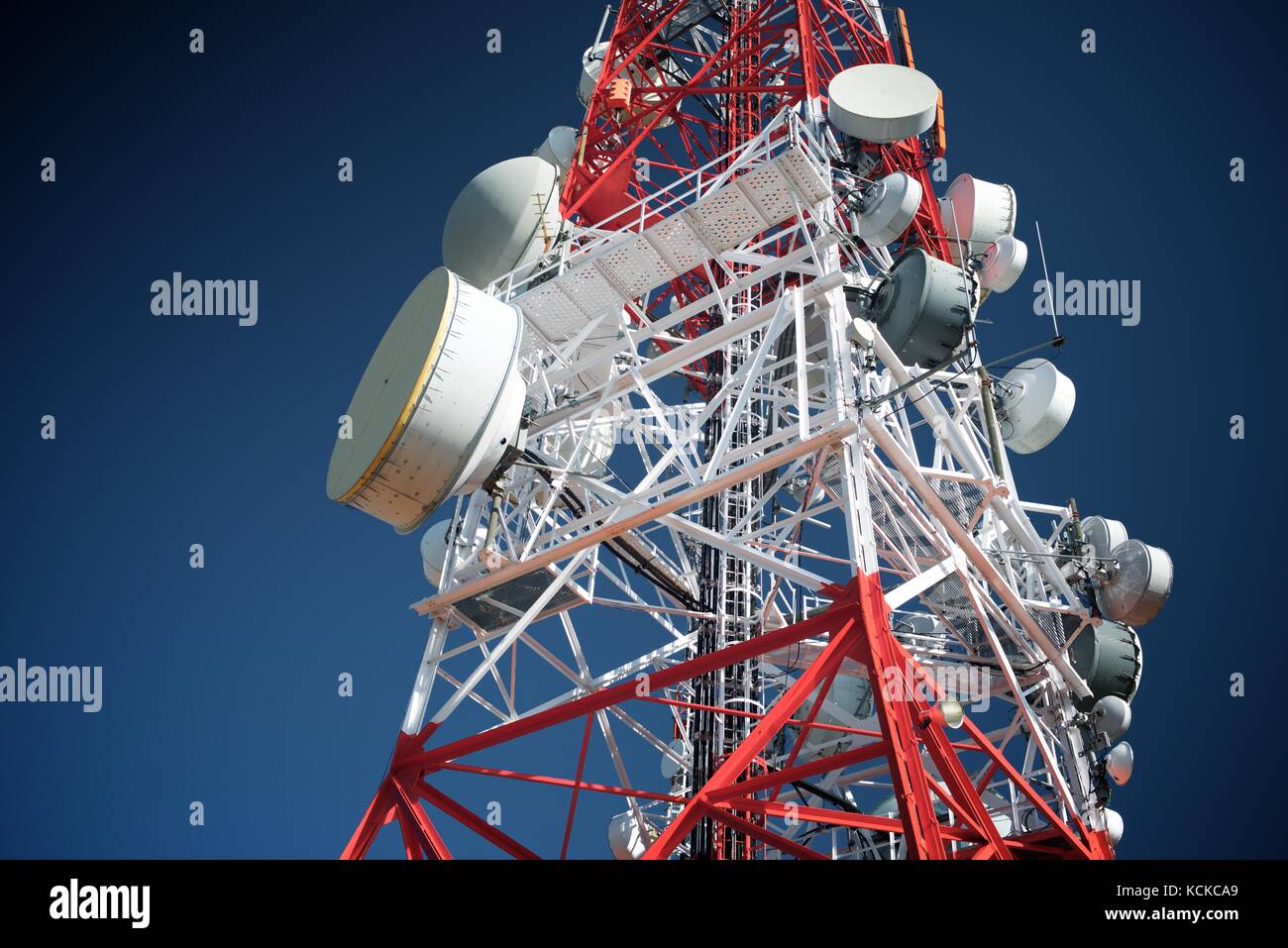 Telecommunications tower with clear blue sky Stock Photo - Alamy