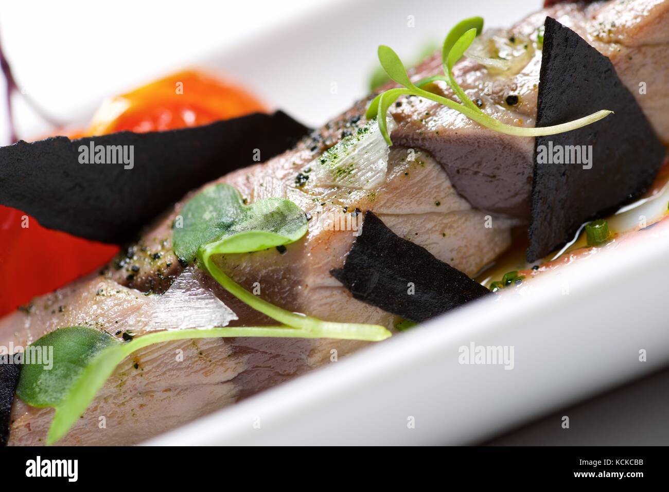 Typical tuna tapa in a small white dish Stock Photo - Alamy