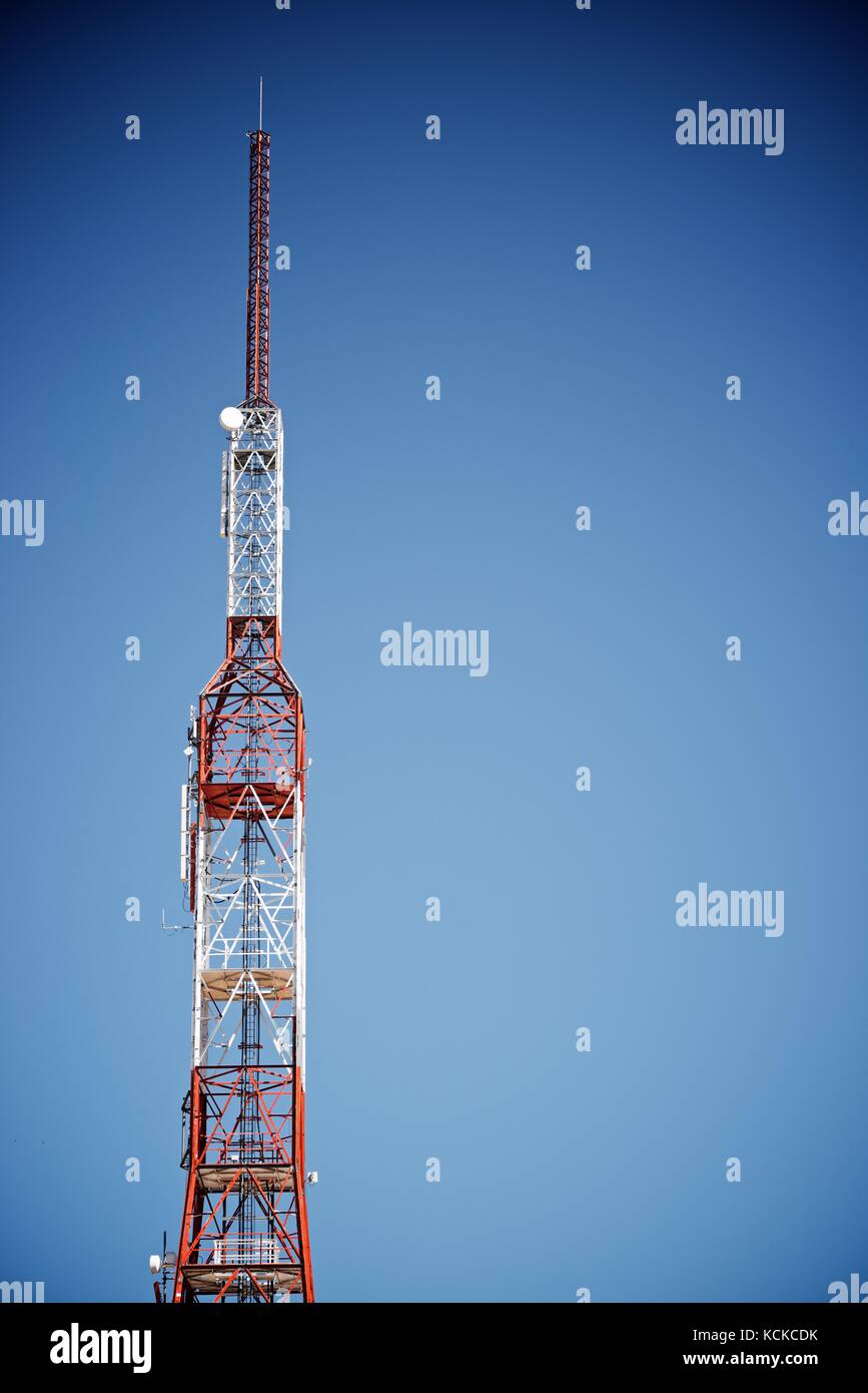 Telecommunications tower with clear blue sky Stock Photo - Alamy