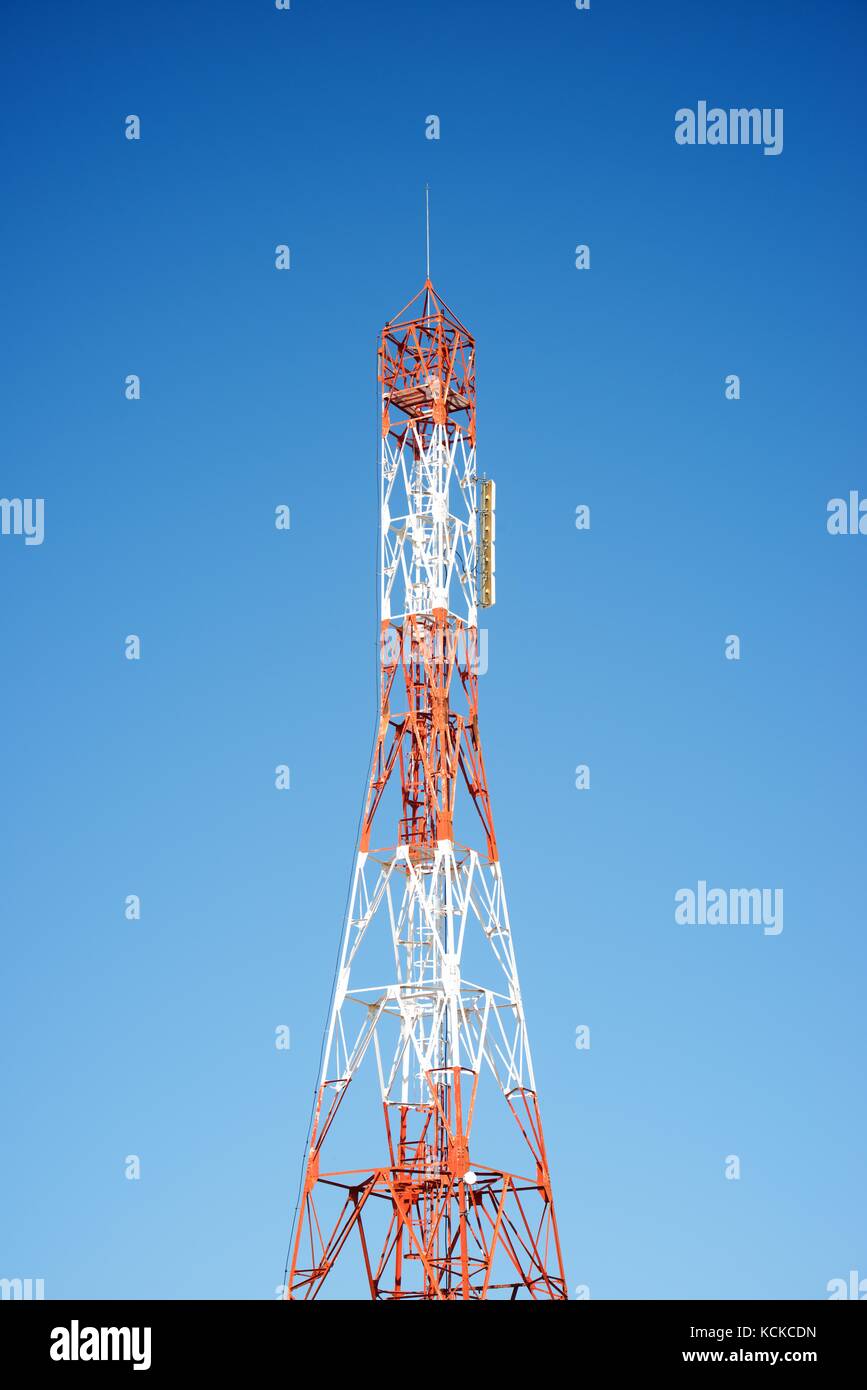 Telecommunications tower with clear blue sky Stock Photo - Alamy