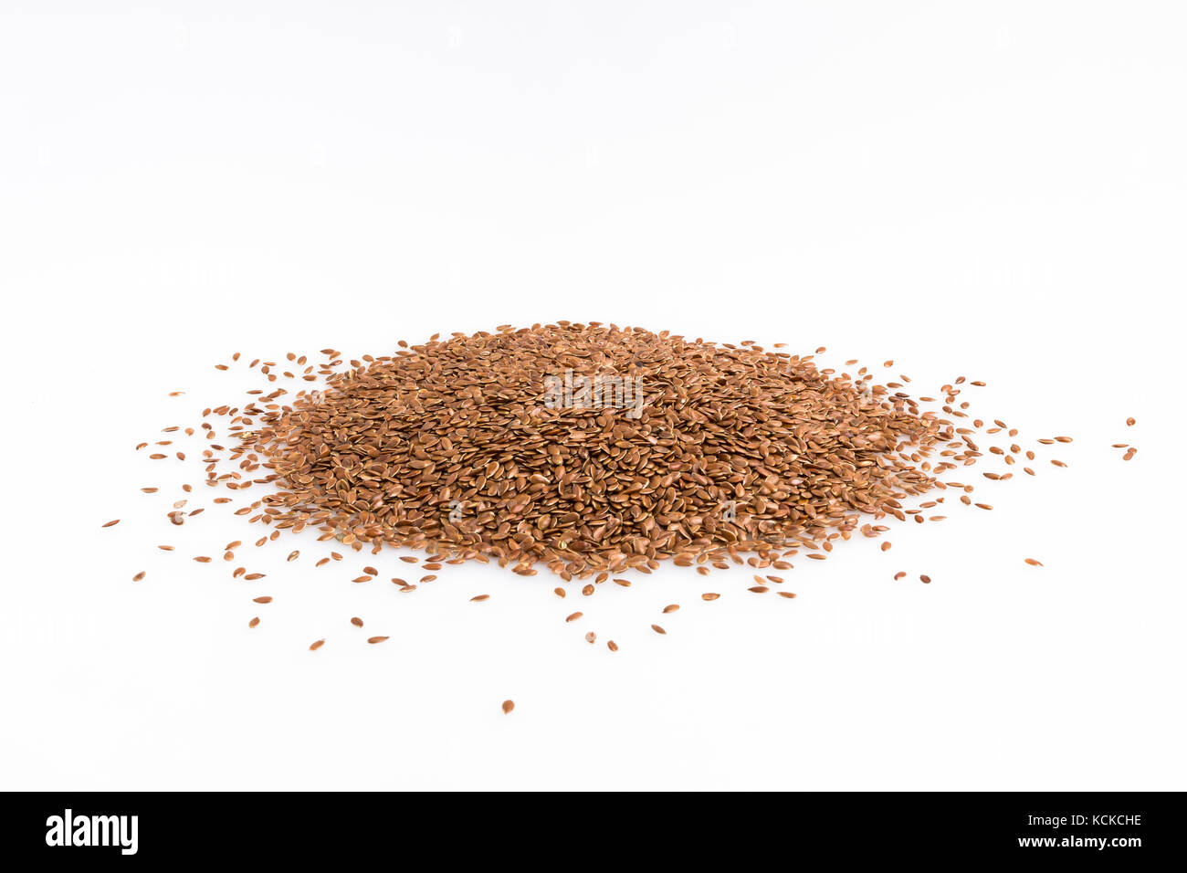 Close up of flax seeds isolated on white background Stock Photo - Alamy