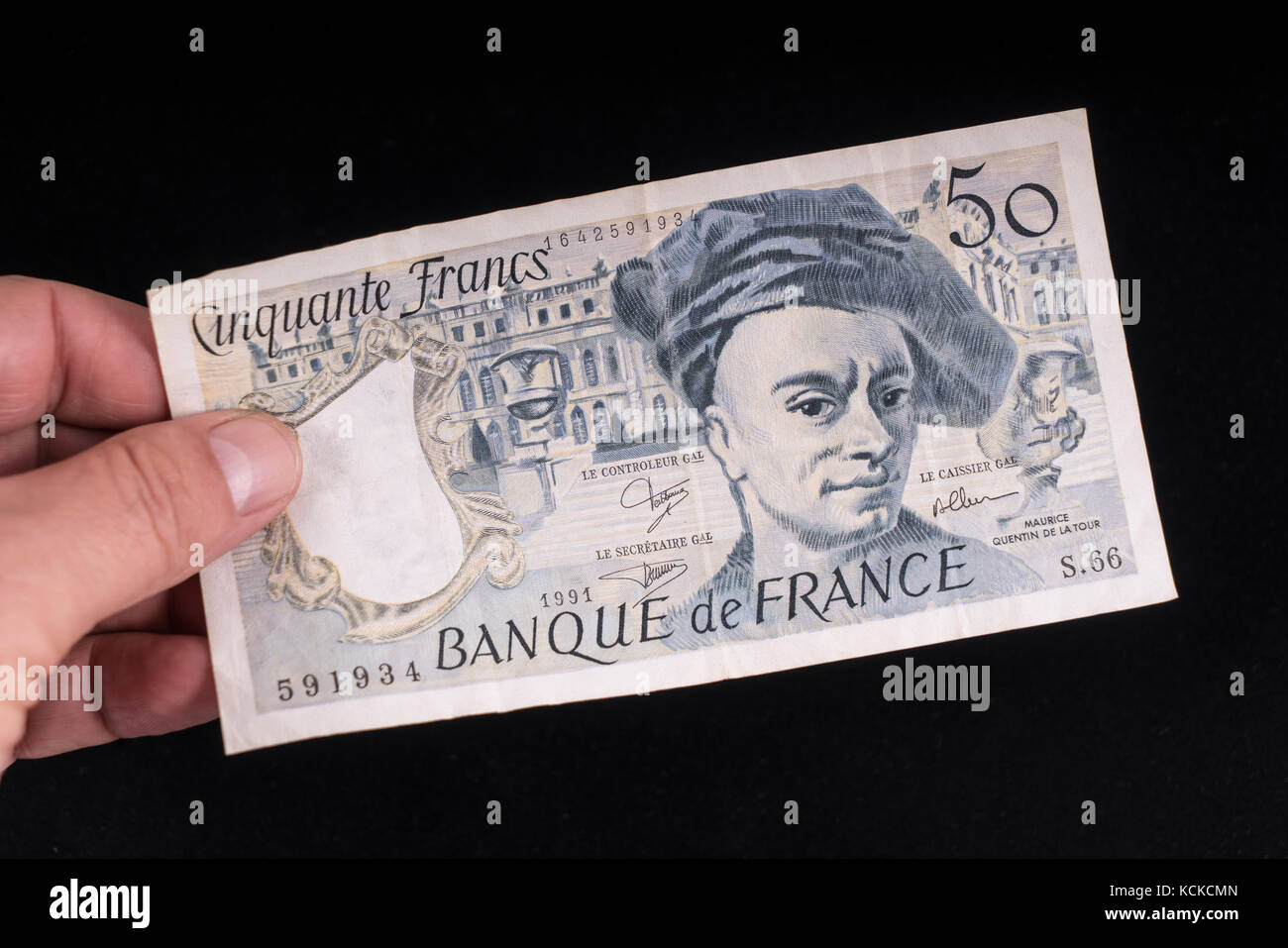 Old french banknote on the hand Stock Photo - Alamy