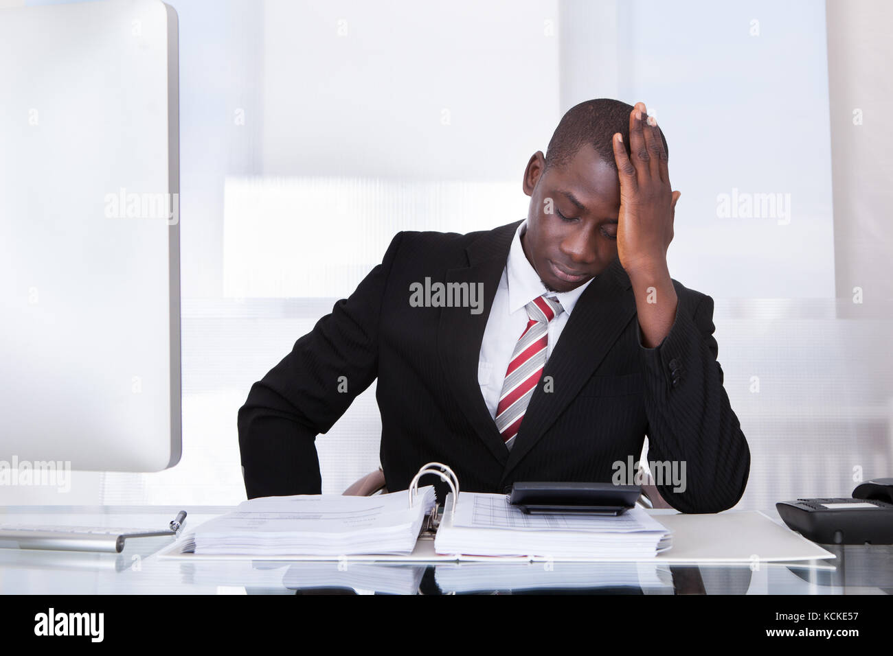 Portrait Of Frustrated African Businessman With Bills And Calculator ...