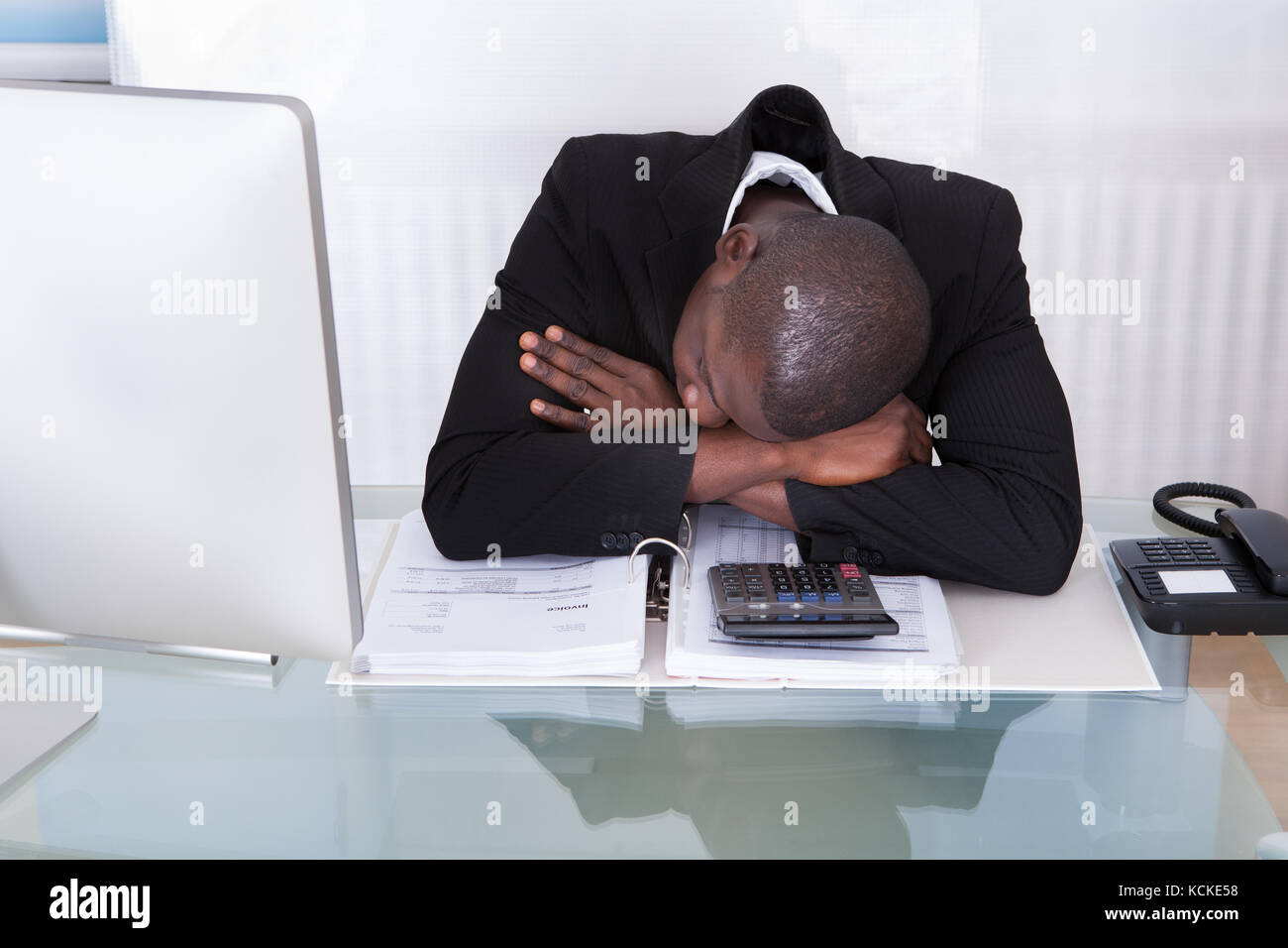 Black businessman sleeping desk hi-res stock photography and images - Alamy