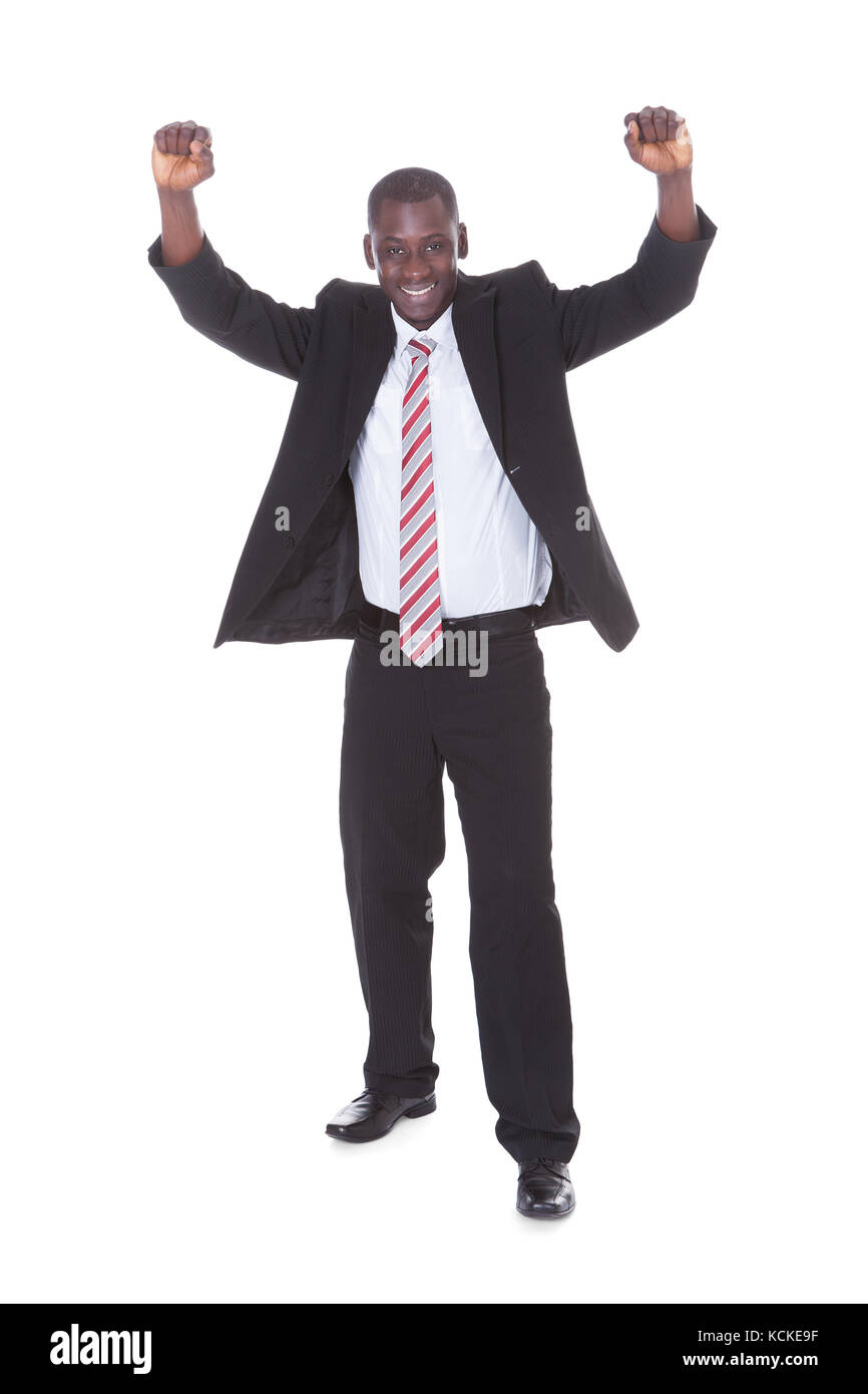 Portrait Of Excited Young Businessman With Hand Raised Stock Photo - Alamy