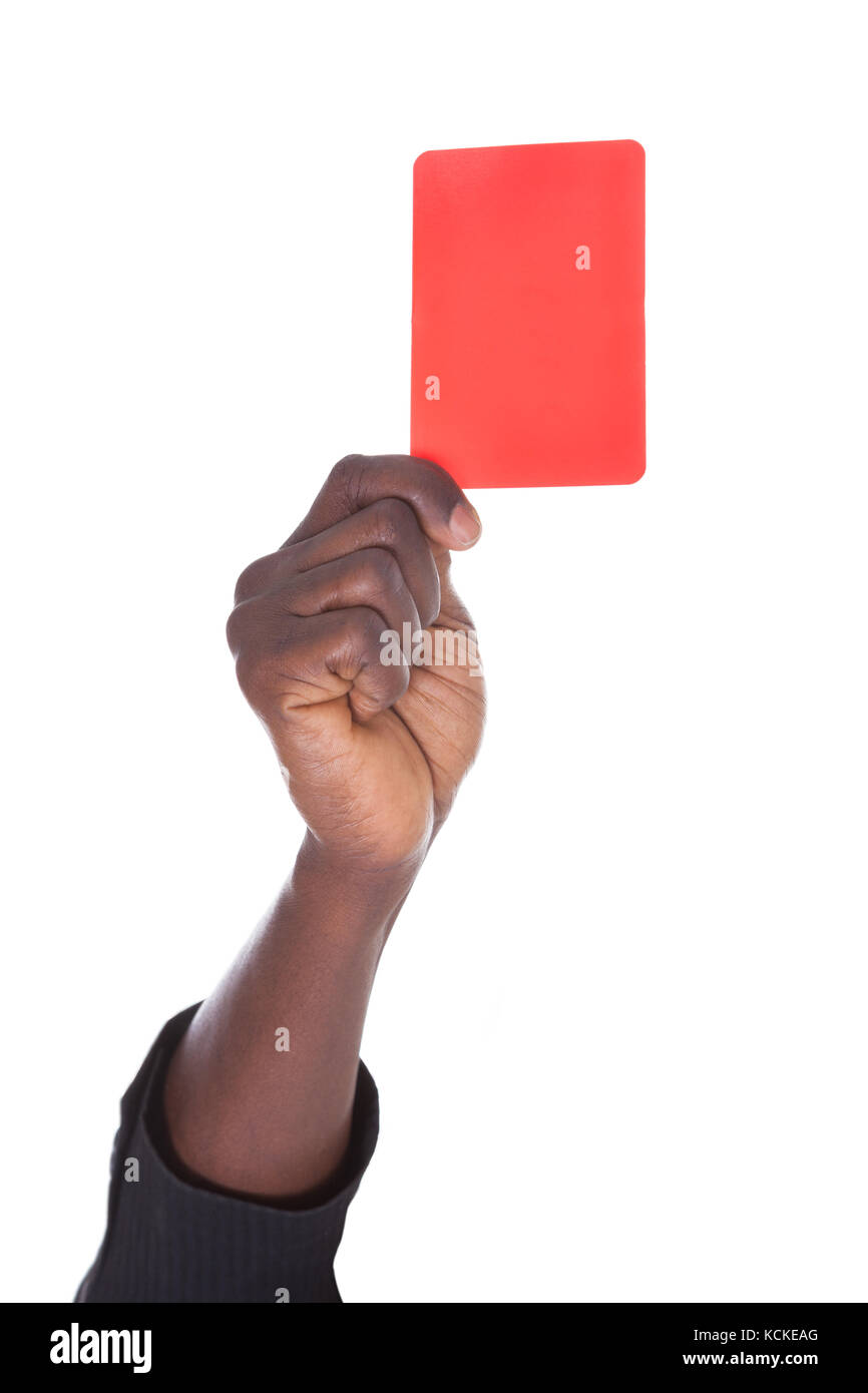 Close-up Of Person's Showing Red Card On White Background Stock Photo ...