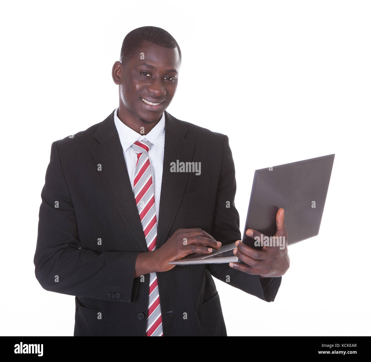 Young African Businessman Holding Laptop Over White Background Stock ...