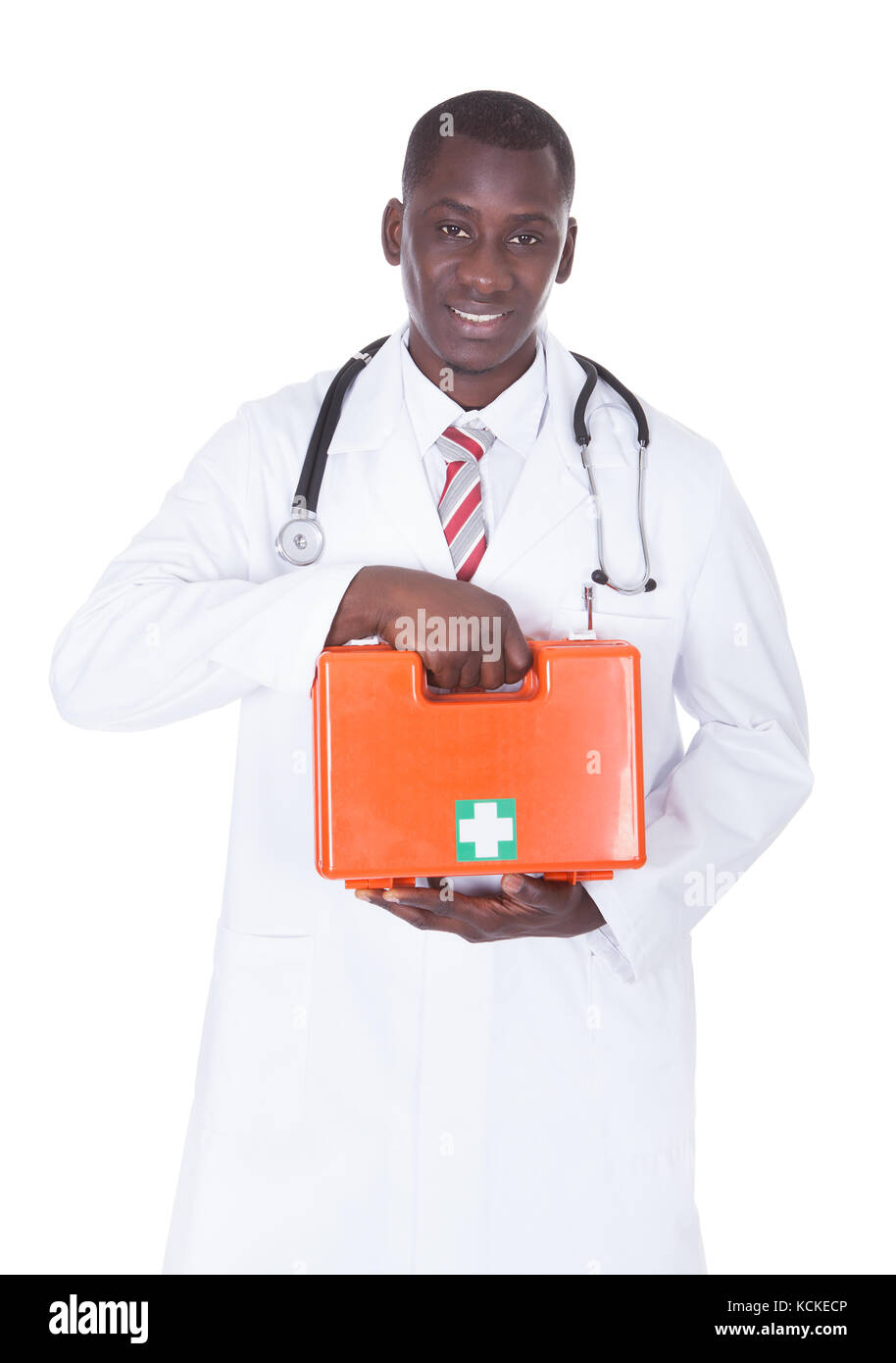 Young Male African Doctor Holding First Aid Box Over White Background ...