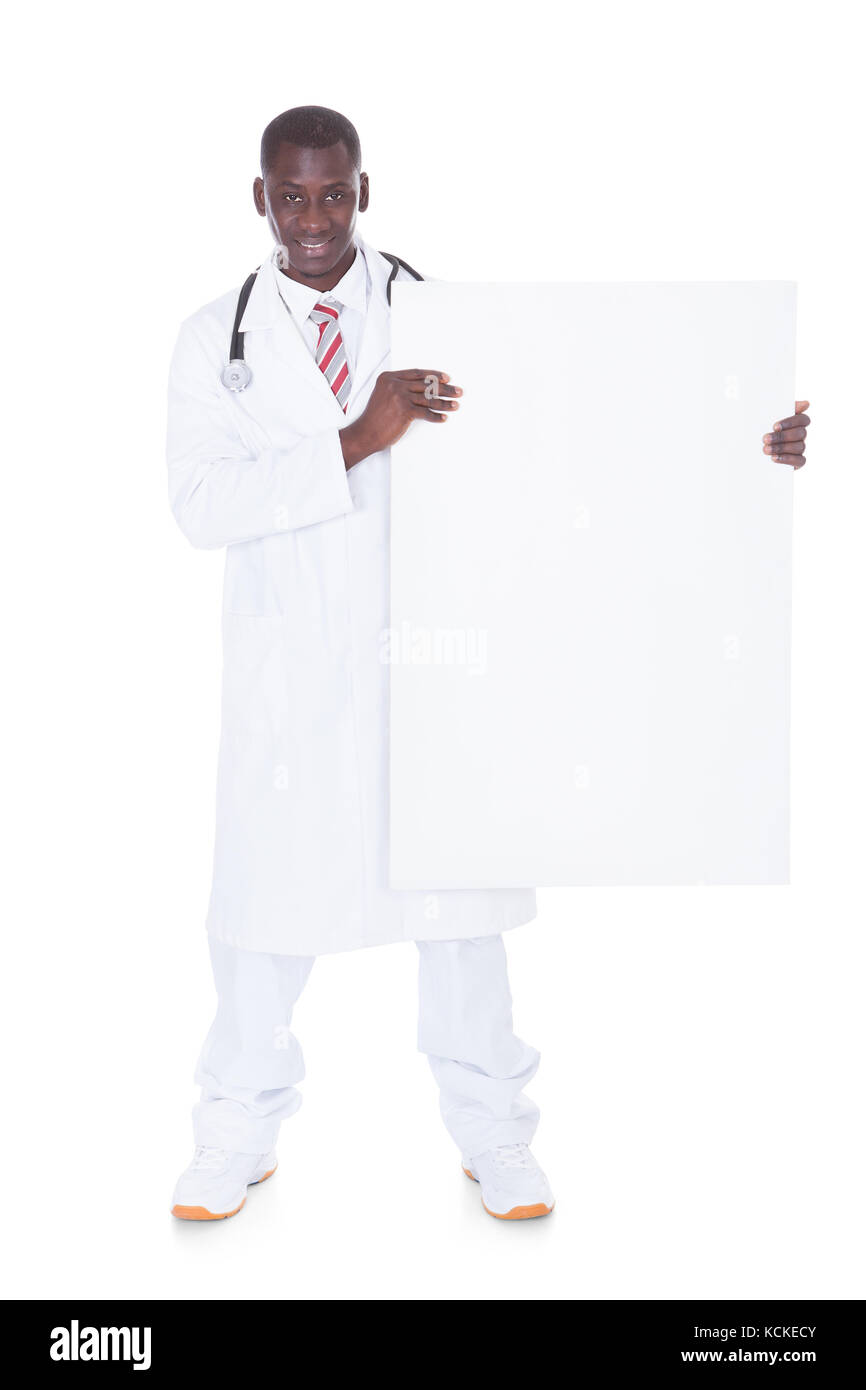 Young Male African Doctor Holding Placard Over White Background Stock ...