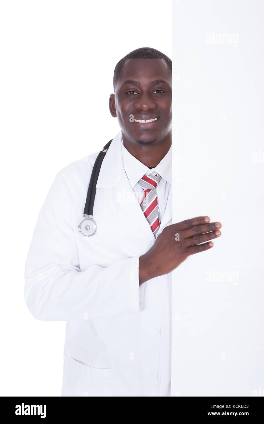 Young Male African Doctor Holding Placard Over White Background Stock ...