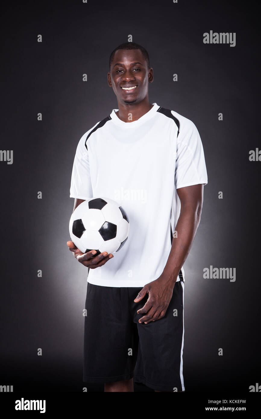 Man holding football shirt hi-res stock photography and images - Alamy