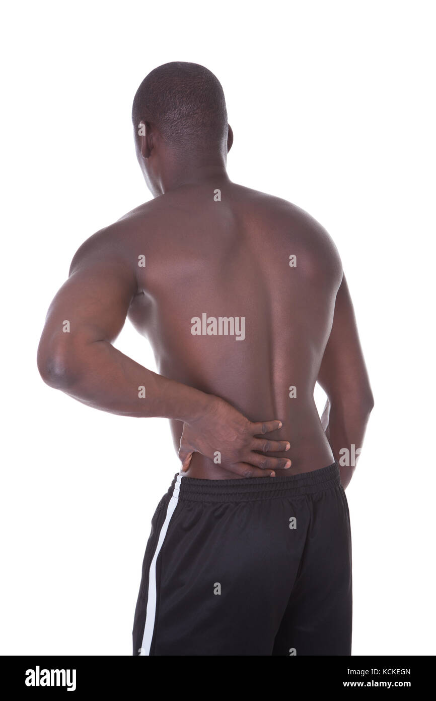 Shirtless African Young Man Suffering From Back Pain Stock Photo - Alamy