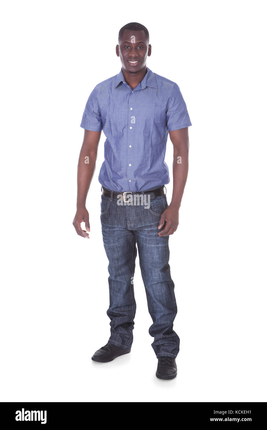 Happy Young Man Standing Over White Background Stock Photo - Alamy Happy Young Man Standing Over White Background Stock Photo - Alamy