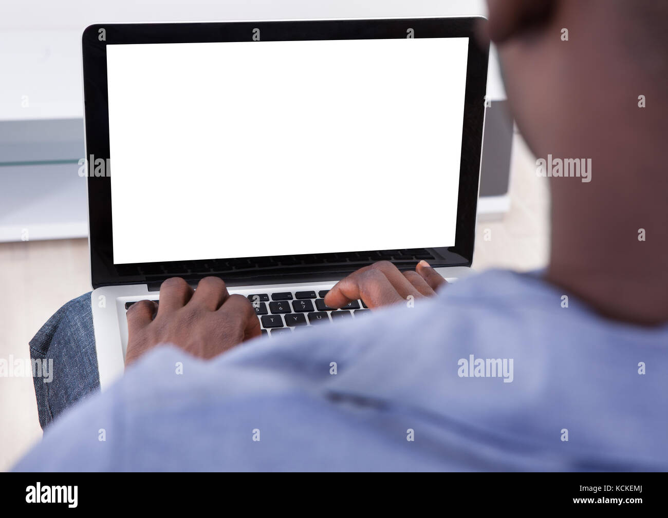 African man technology typing hi-res stock photography and images - Alamy