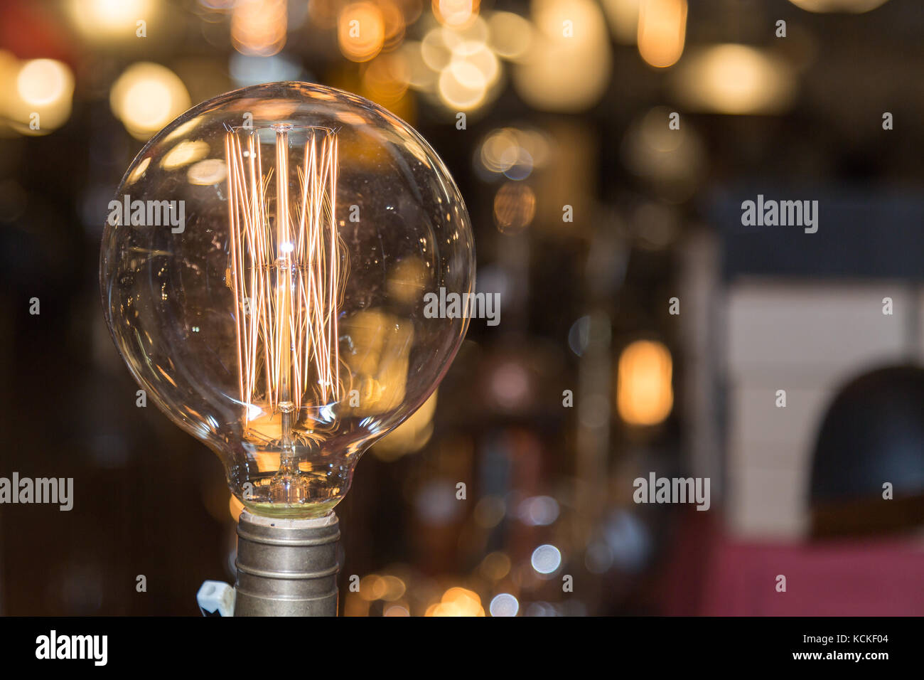 Single Vintage Electric Light Bulb with Incandescent Filament Stock ...
