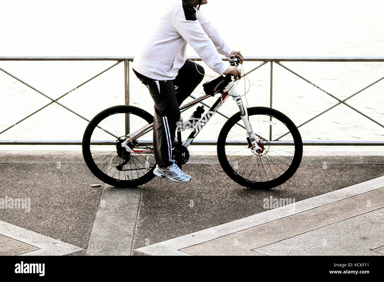 Unrecognizable person riding a bicycle Stock Photo - Alamy