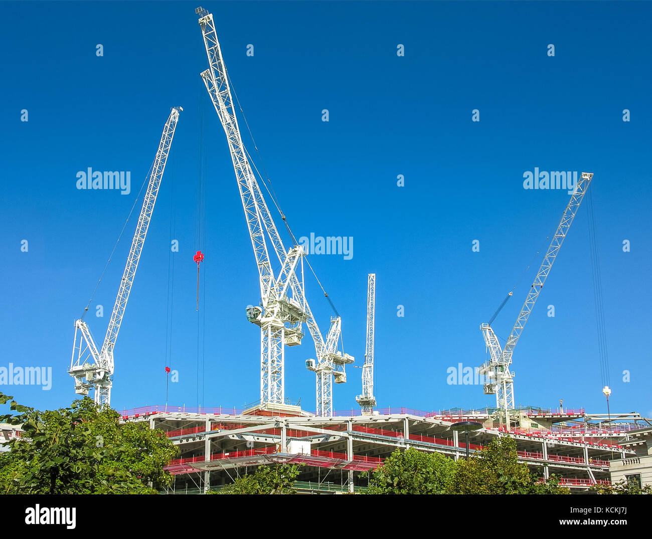 London construction site with cranes on a blue sky Stock Photo - Alamy
