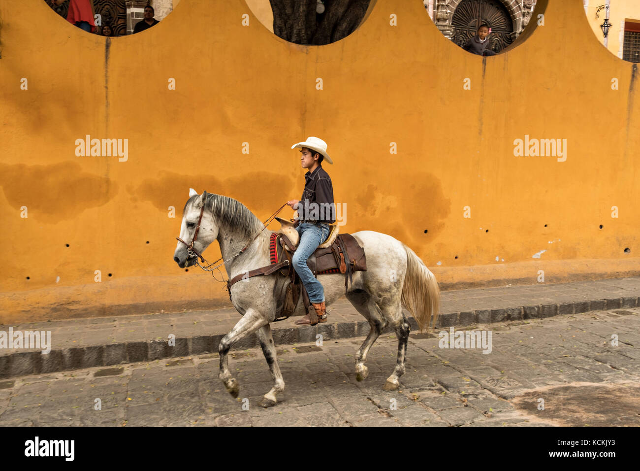 A Mexican cowboy ride through the streets of San Miguel de Allende ...