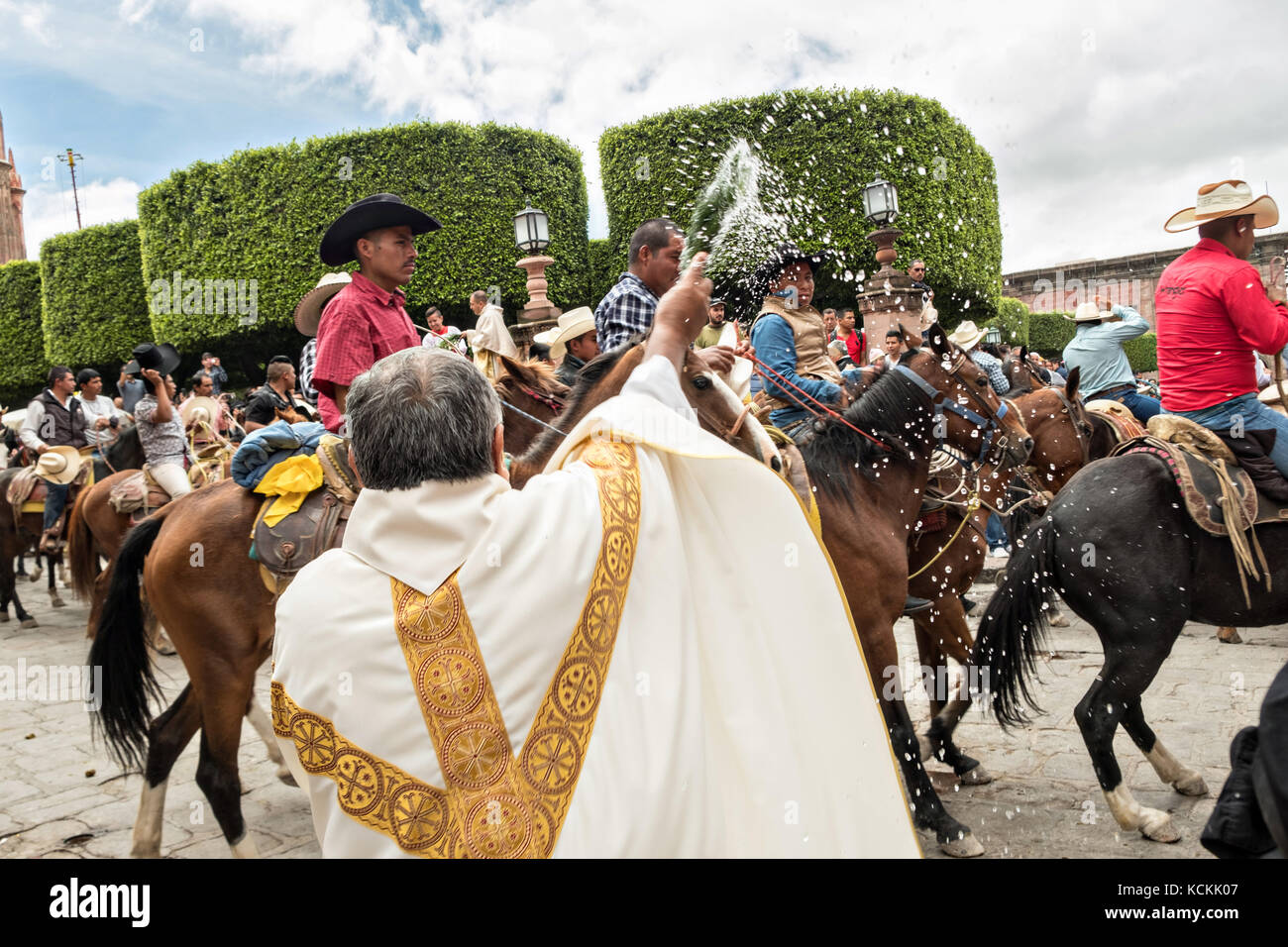 Mexican cowboys are sprinkled with holy water by Catholic priests ...