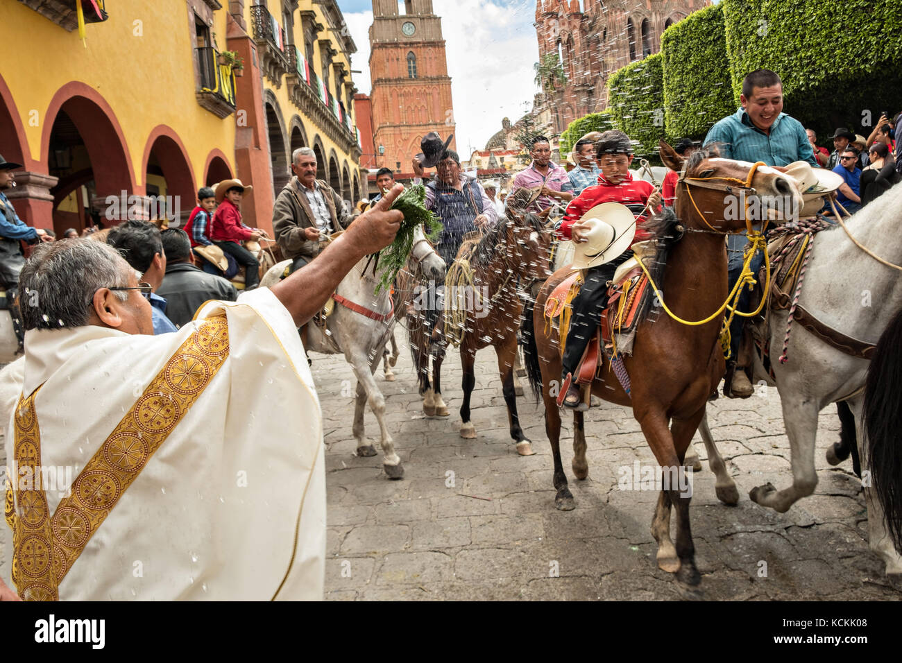 Mexican cowboys are sprinkled with holy water by Catholic priests ...
