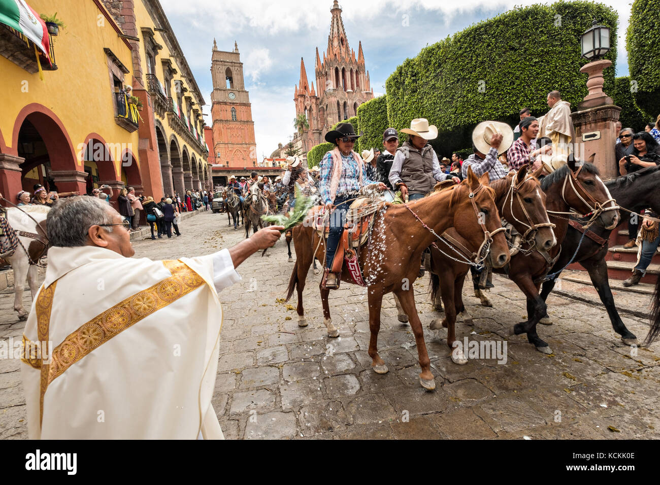 Mexican cowboys are sprinkled with holy water by Catholic priests ...