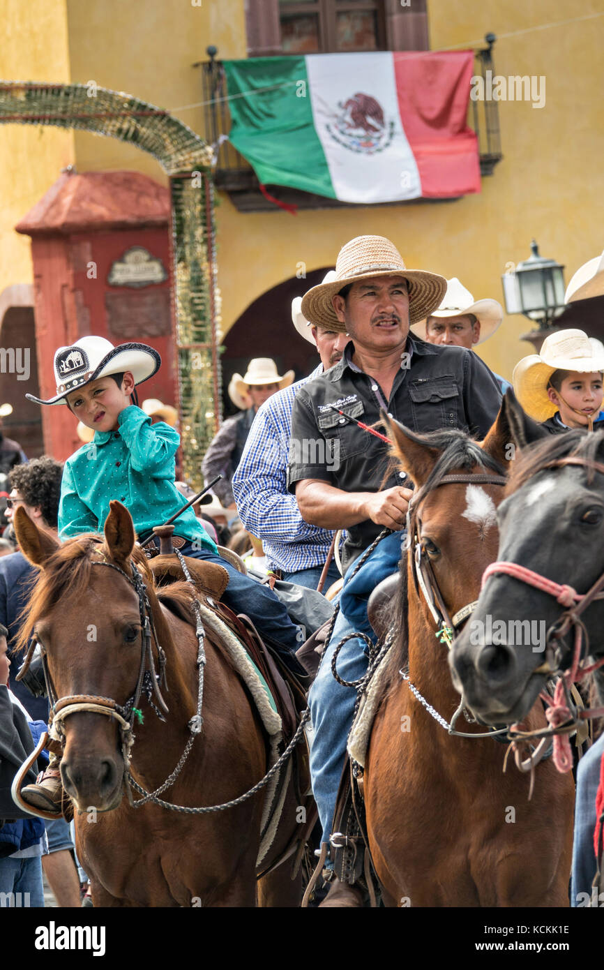 Mexican cowboys ride through the Jardin Allende at the end of their ...