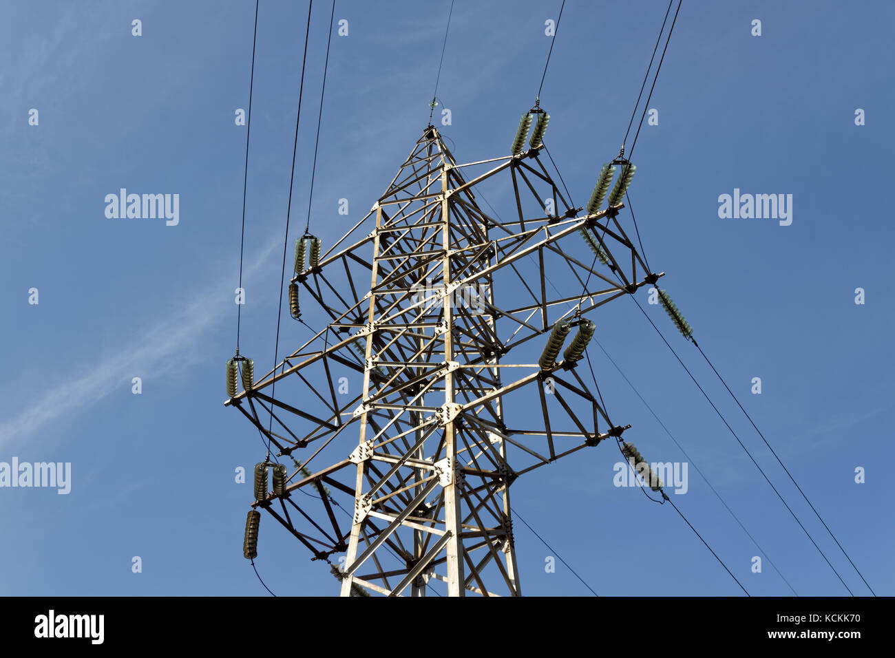 Electric pylon against the backdrop of the blue sky on a summer day ...