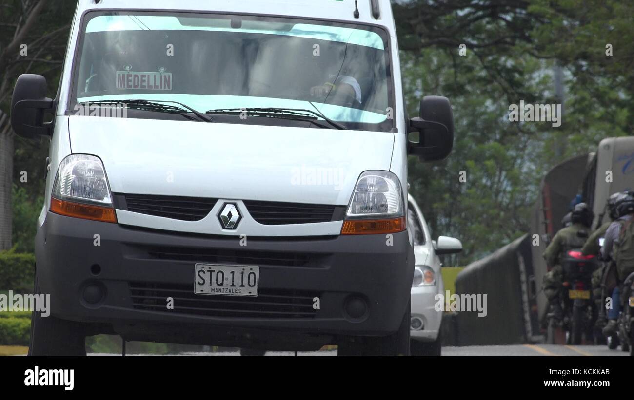 White Minivan Driving Stock Photo - Alamy